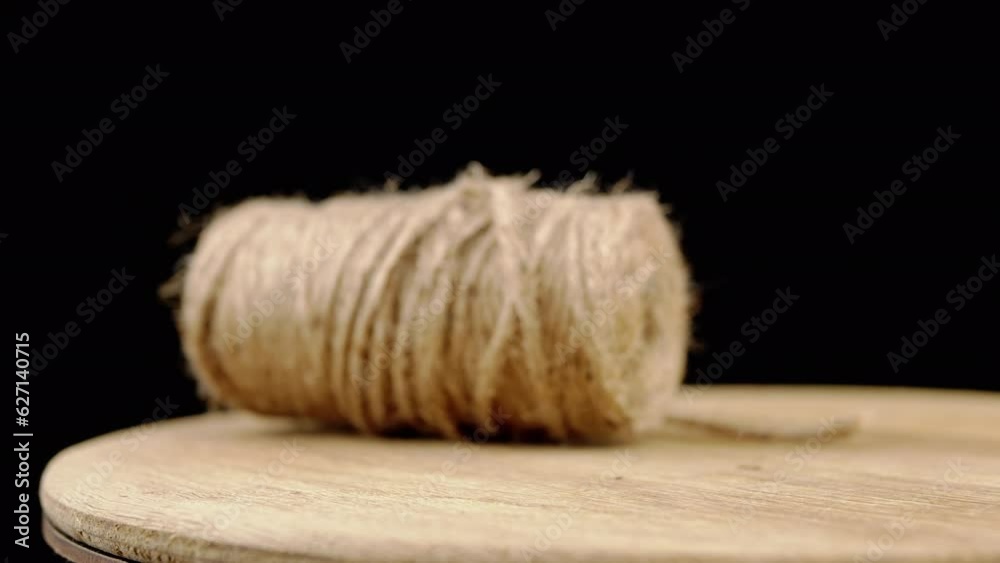Close up, Spool of Hemp Twine Rotation on a Wooden Board, Black ...