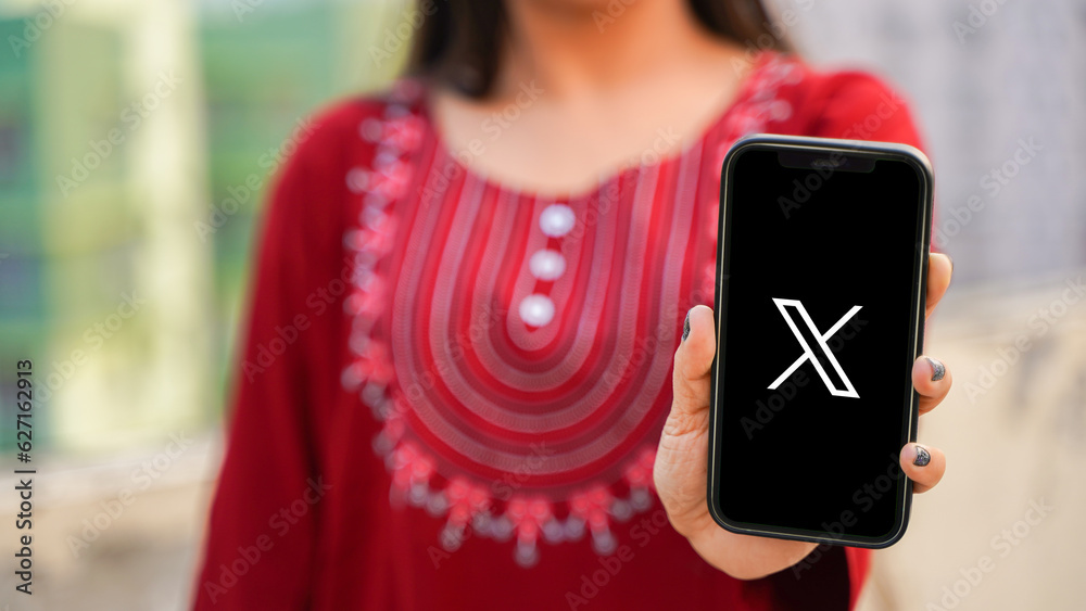 Twitter X logo on the mobile phone screen, brand new logo displayed ...