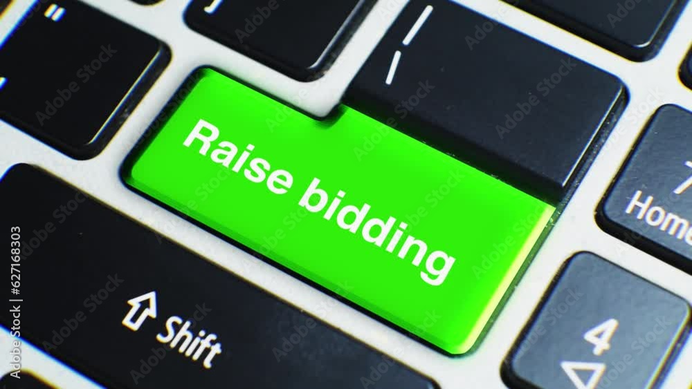 Laptop Keyboard Close Up and Finger Press Raise Bidding Word or Text ...