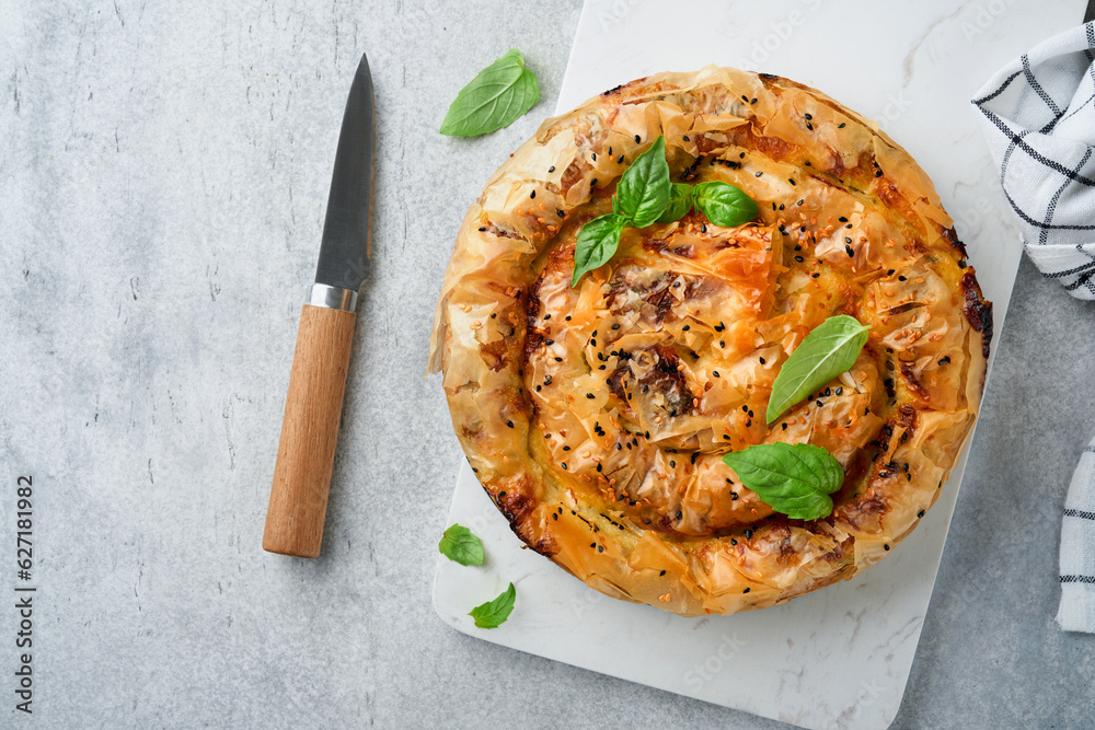 Delicious pie Spanakopita with soft feta cheese and spinach on old gray ...