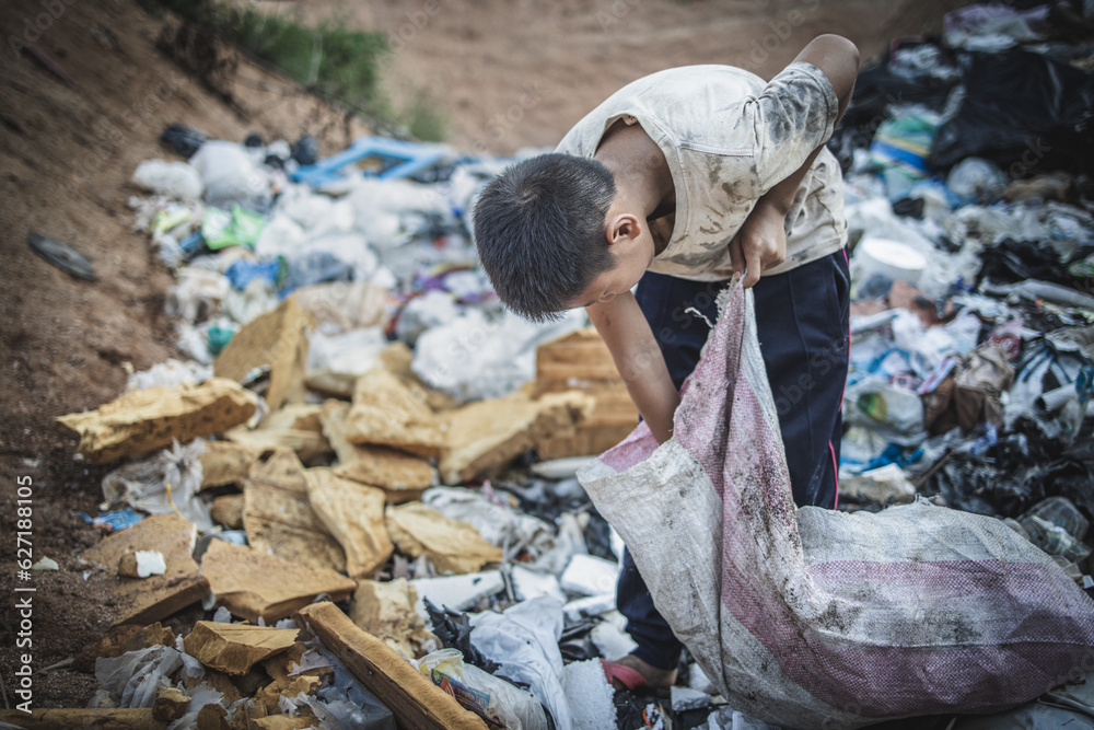 Child labor. Children are forced to work on rubbish. Poor children ...