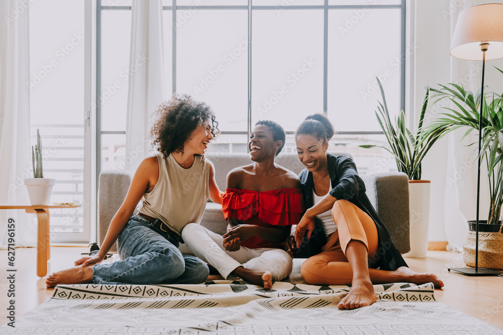 Beautiful and young latin american women having fun and bonding at home ...