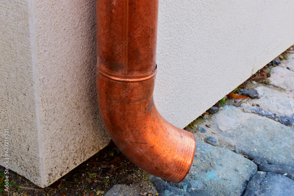 shiny new copper rain water leader, downspout or down pipe detail ...