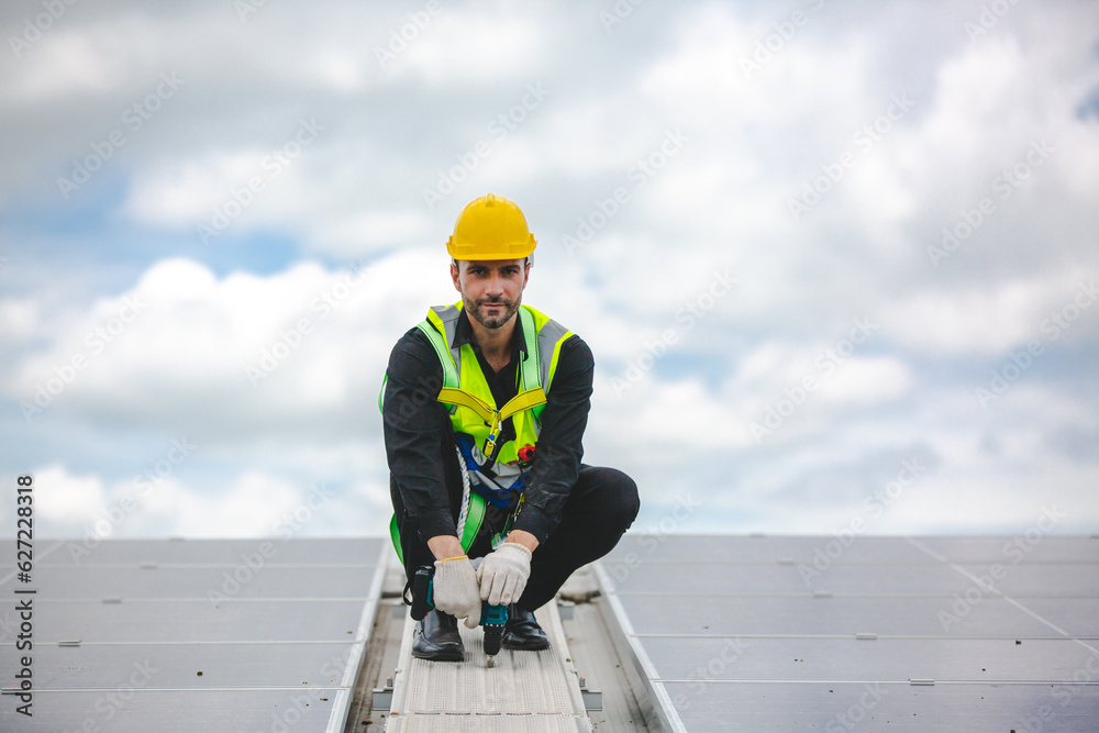 Professional technicians carrying photovoltaic solar moduls on factory ...