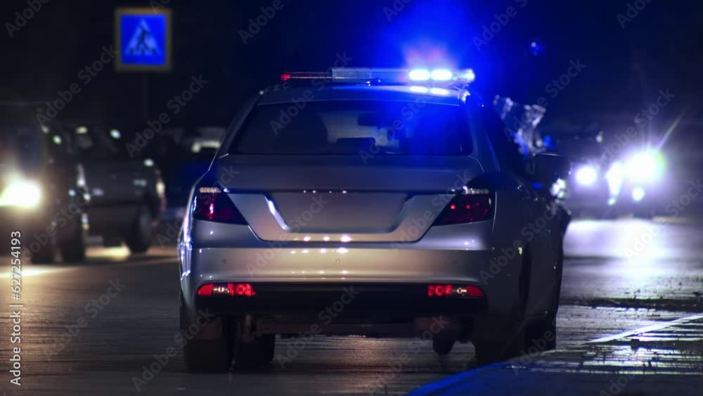 Lightbar flasher blinking blue light atop police car at night, siren ...