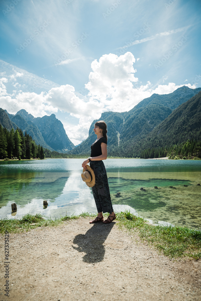 Beautiful female model at lago di dobbiaco in Italy, the dolomites ...