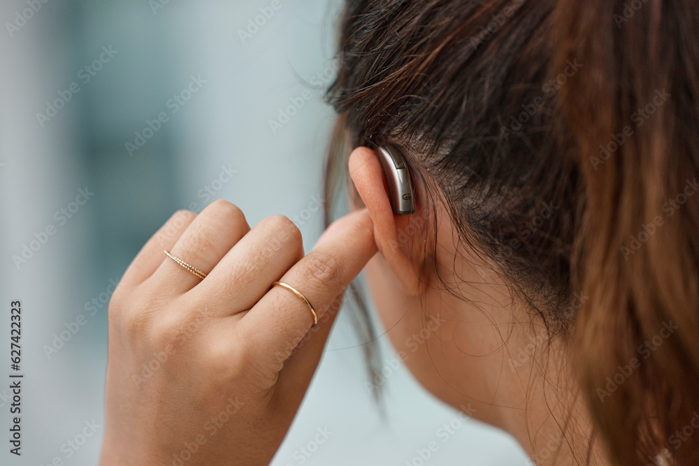 Hearing aid, closeup and ear of woman with disability from the back for ...