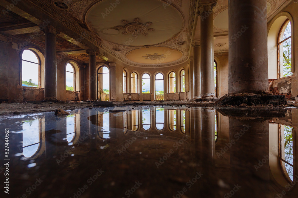 Flooded large hall with columns in old abandoned mansion, water ...