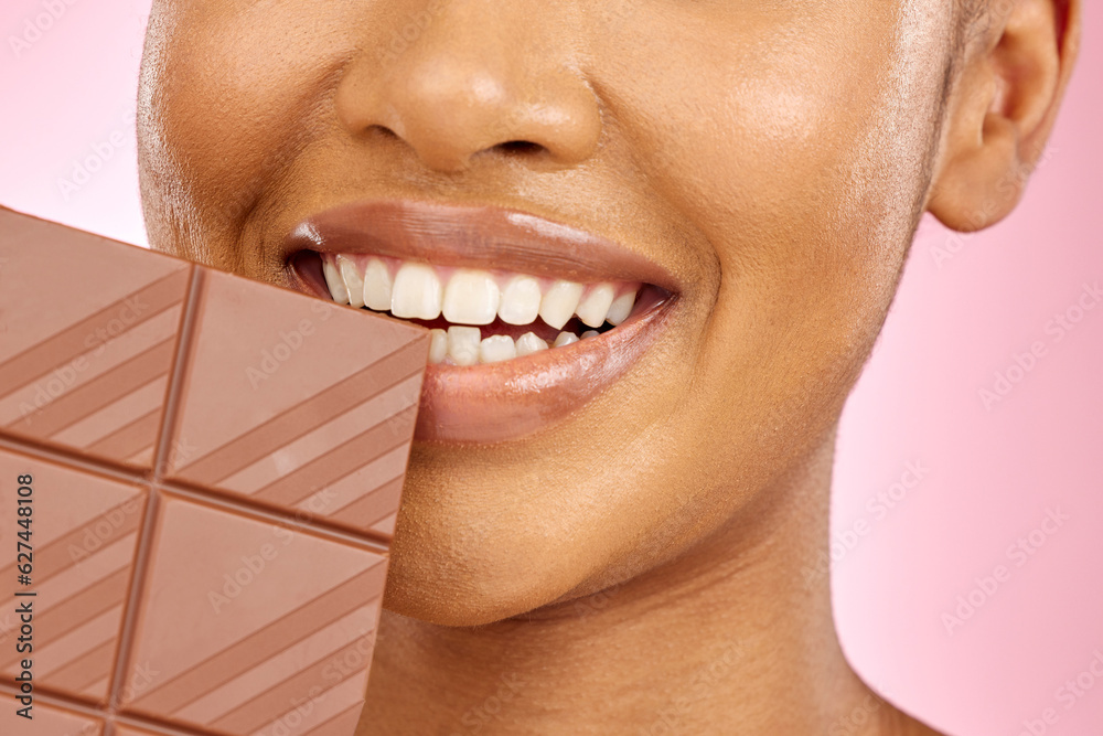 Woman, mouth and chocolate in studio closeup with smile, eating and ...