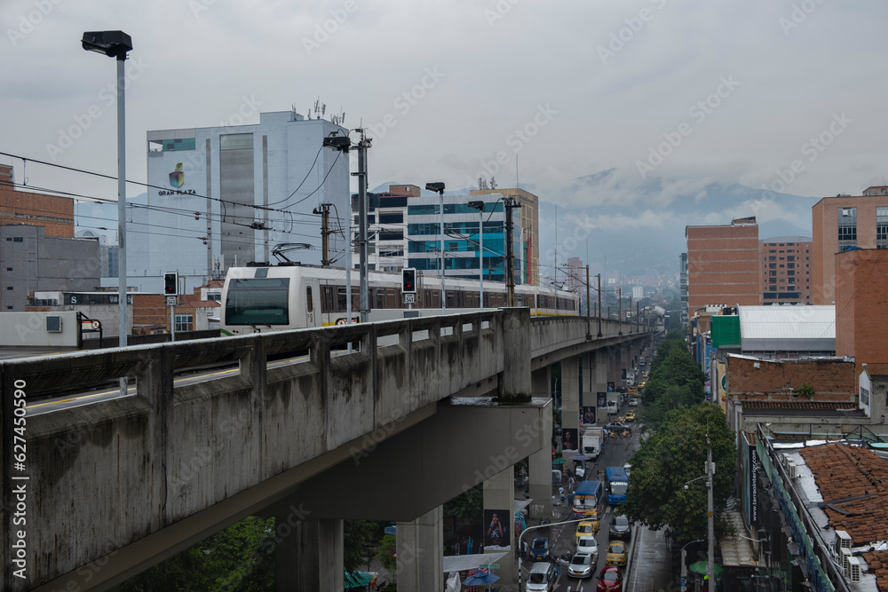 Aerial view of busy street in downtown and above ground raised metro ...