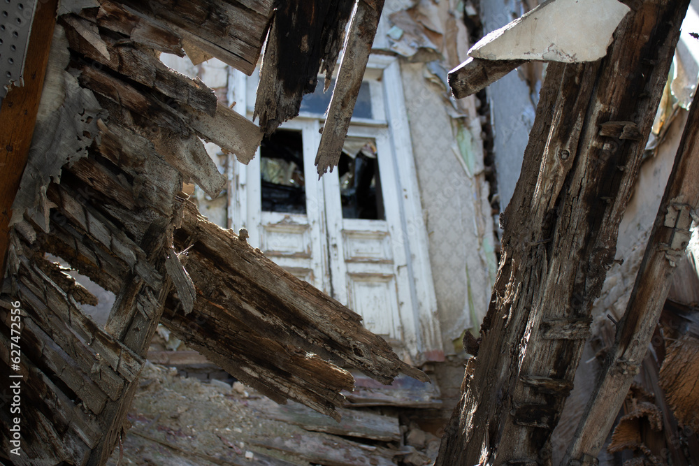 Broken old house in Georgian city of Tbilisi. View from hole in wooden ...