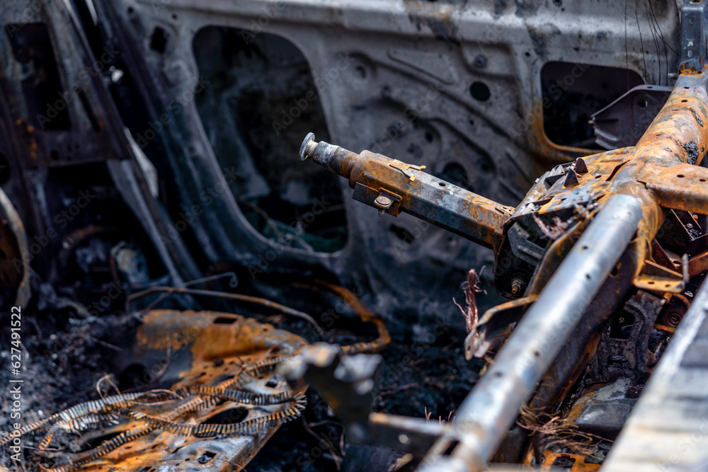 The car after the fire. Iron parts of a burnt car. Abandoned burnt-out ...
