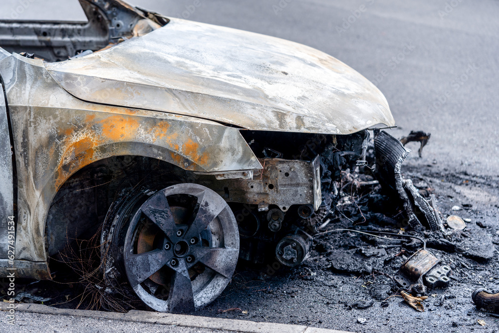 The car after the fire. Iron parts of a burnt car. Abandoned burnt-out ...