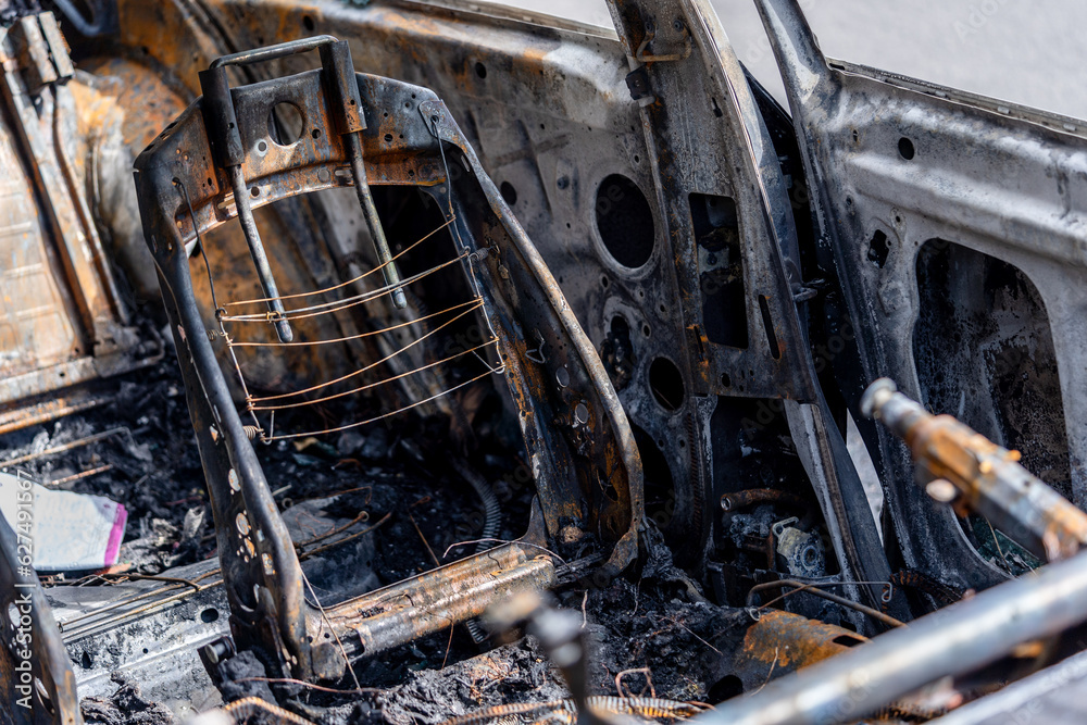 The car after the fire. Iron parts of a burnt car. Abandoned burnt-out ...