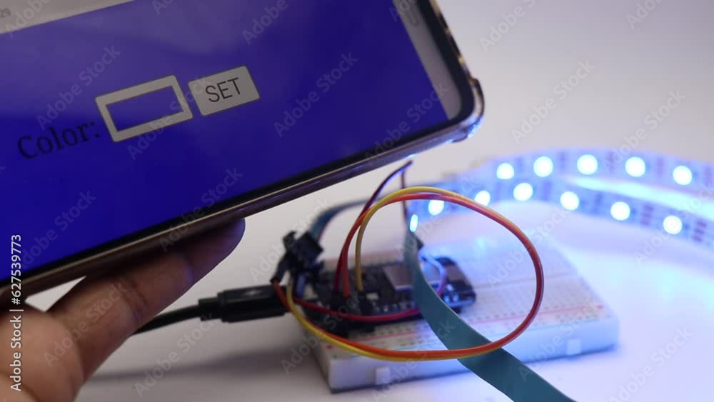 Vidéo Stock Breadboard circuit with a development board and LED strip ...