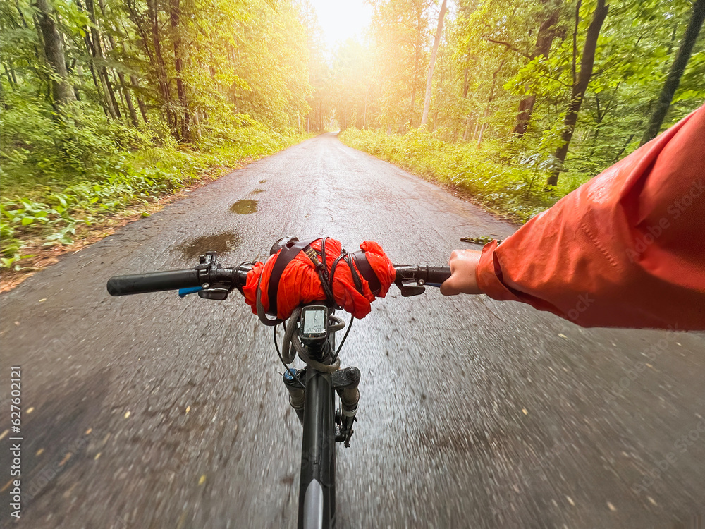 Foto de Bike trip to the forest. Journey on bicycle touring. Bike packing POV traveler journey ...