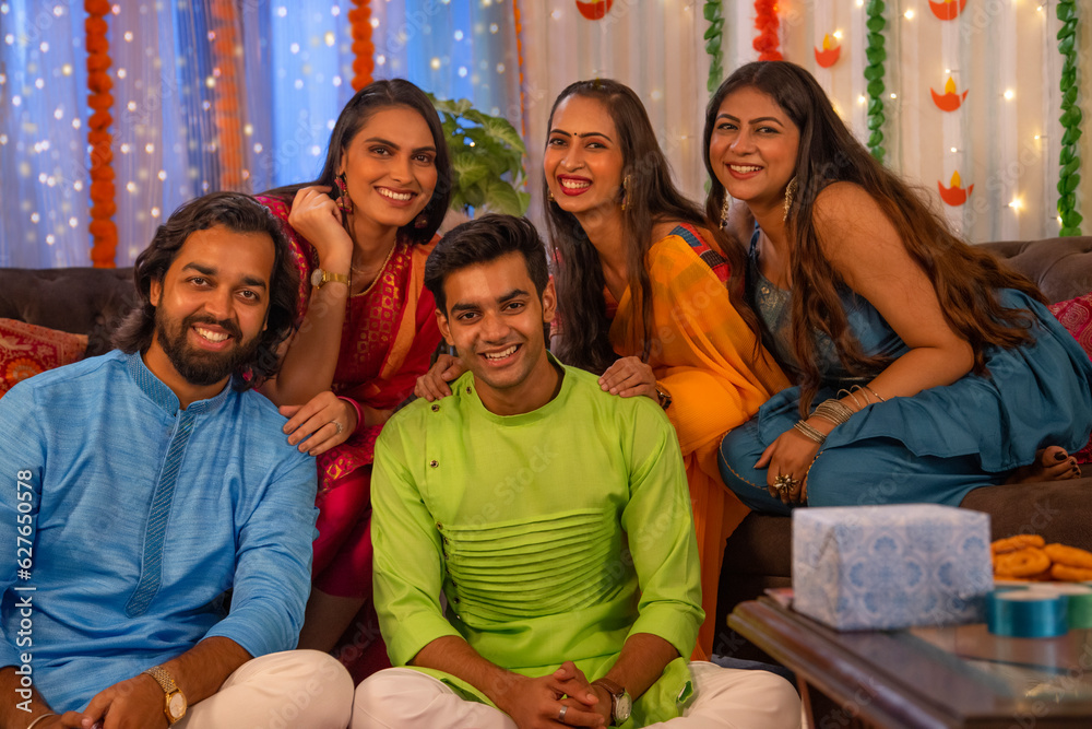 Portrait of happy friends celebrating Diwali together at home Stock ...