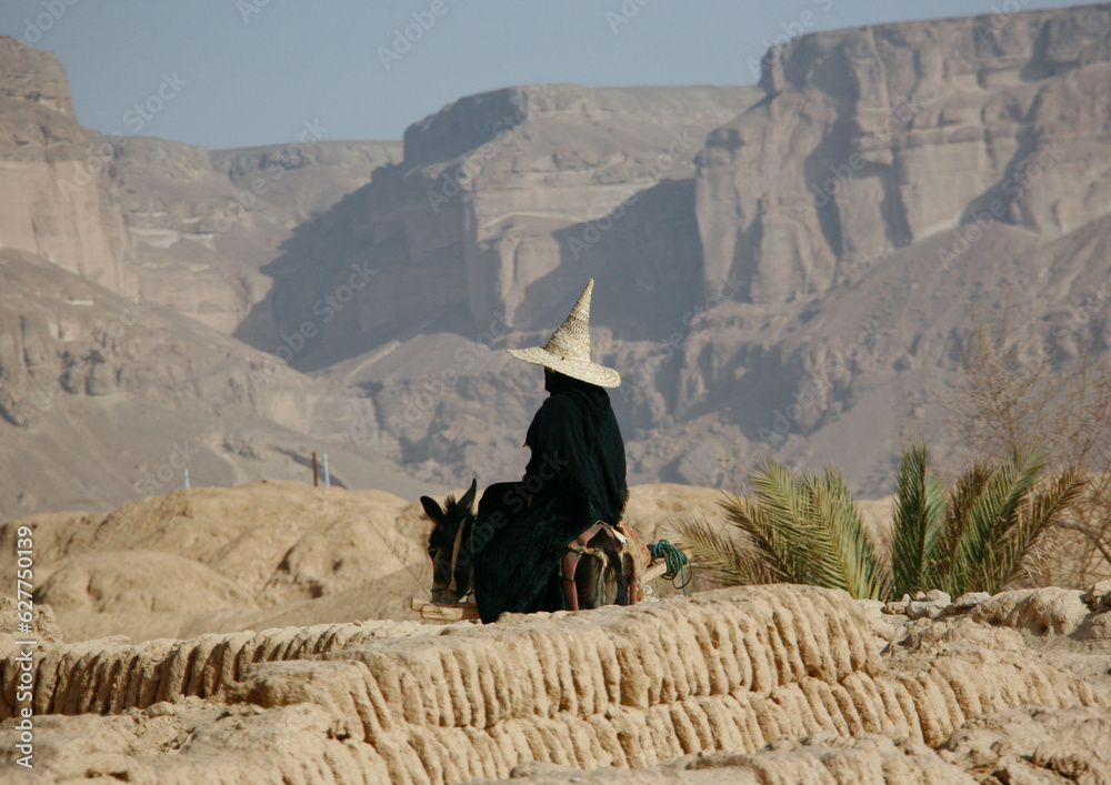 Hadramout woman with a full black dress, gloves and a high hat; The ...