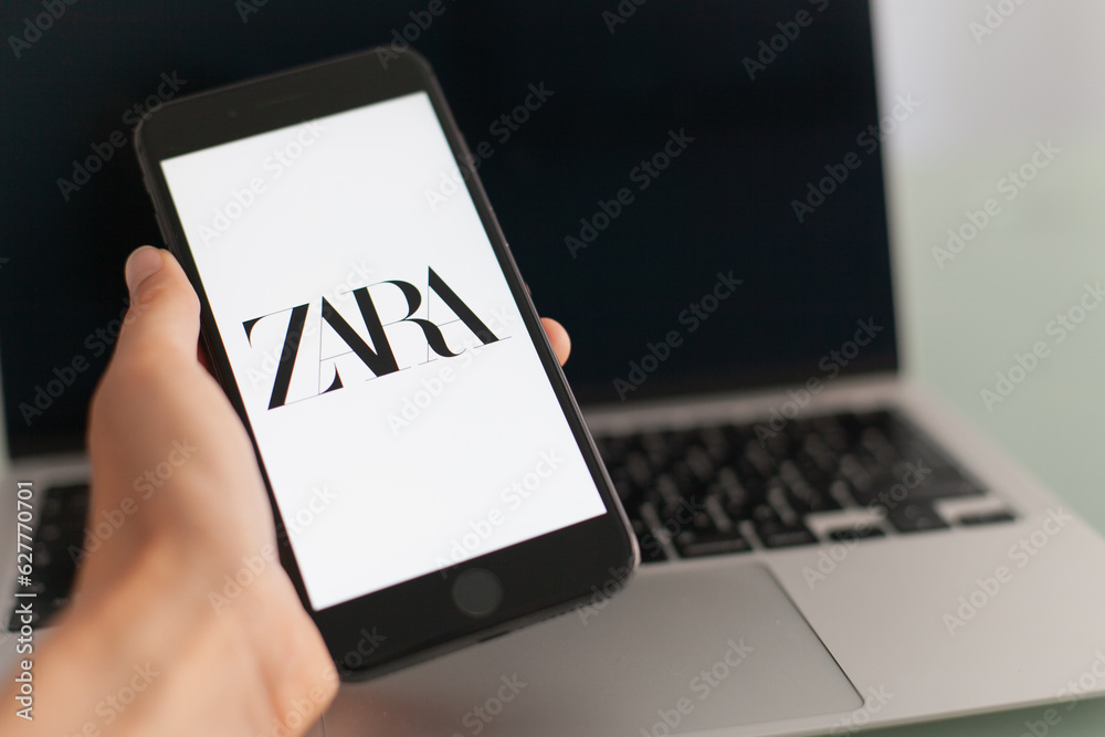 Zara logo on the screen of mobile phone. Inditex group brand identity ...