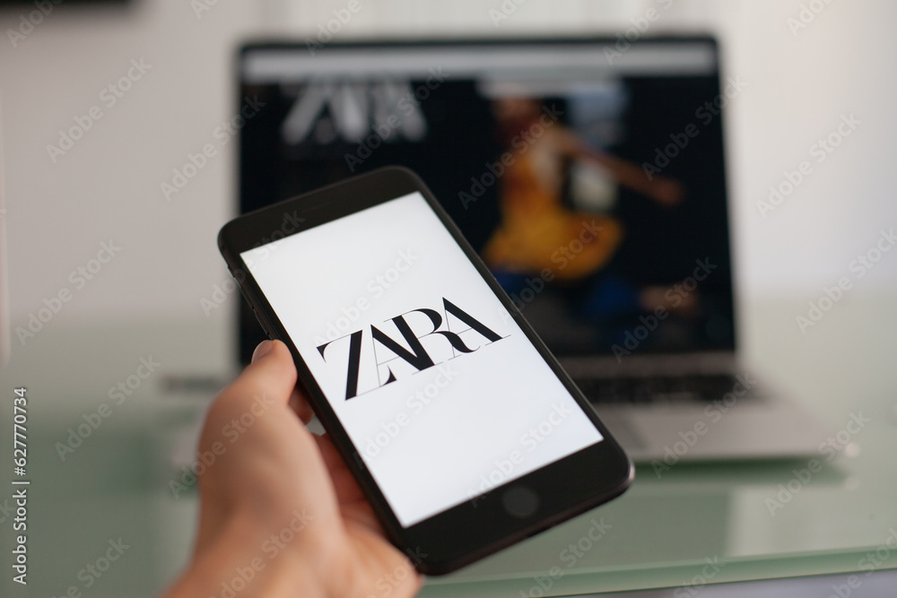 Zara logo on the screen of mobile phone. Inditex group brand identity ...