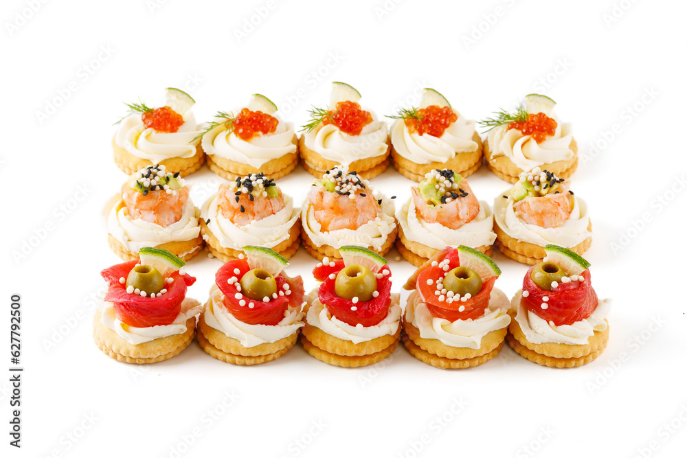 canape set with tiger shrimp, salmon, red caviar on white background ...