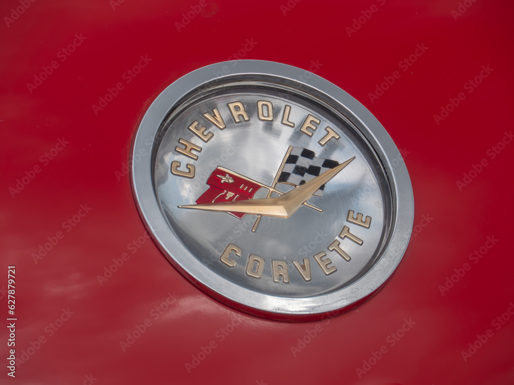 Up Close with the Iconic Chevrolet Corvette Logo on a Red Retro ...