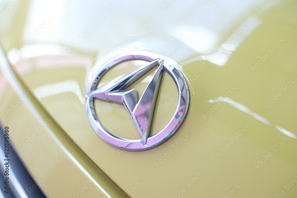 selective focus on the LCGC type Daihatsu Ayla car logo. cheap types of ...