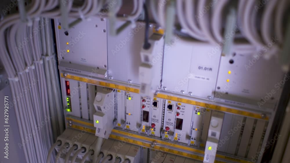 Close-up of a gray electrical control panel in an industrial setting ...