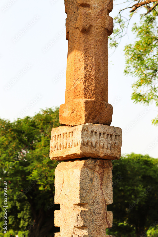 ancient pillars with an infinite viewer near the Qutub Minar Columns ...
