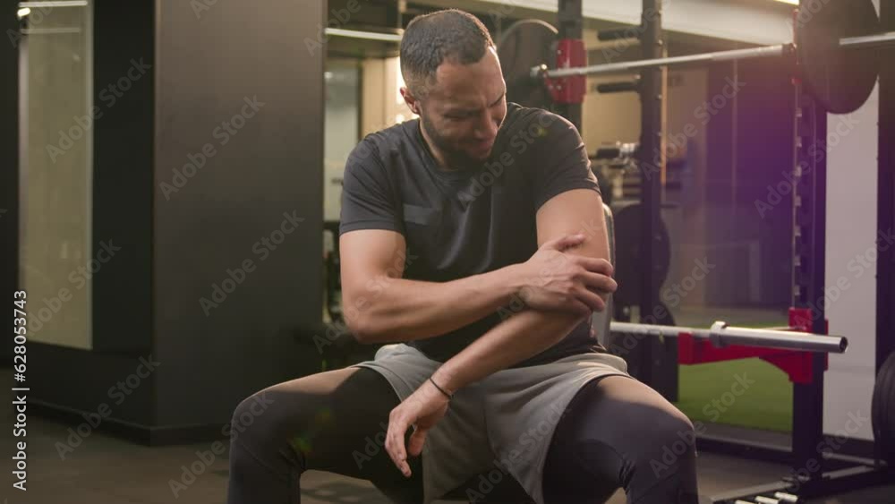 African American man guy in gym doing sport exercise with dumb-bell ...