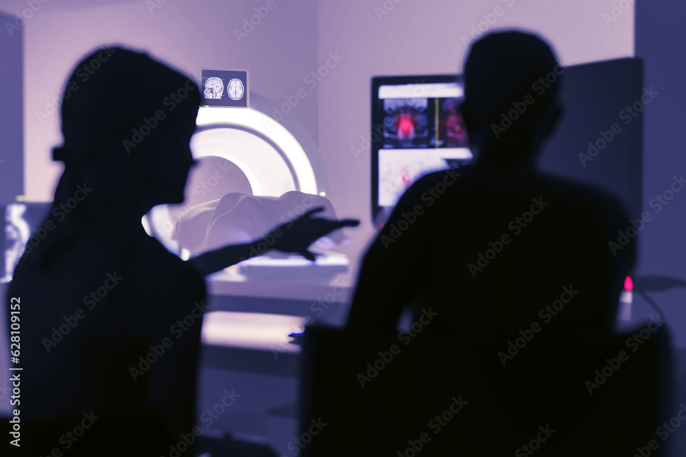 In Control Room Doctor and Radiologist Discuss Diagnosis while Watching ...