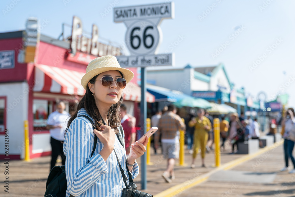 stylish asian Korean woman traveler on vacation at santa monica pier ...