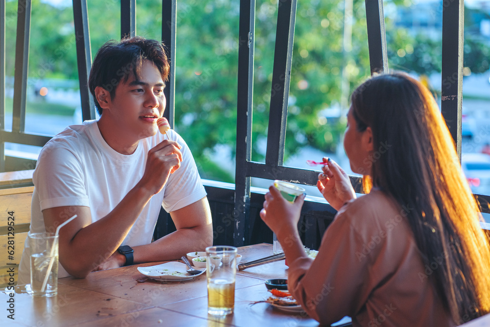 Asian man and woman couple eating dinner date together and boyfriend ...