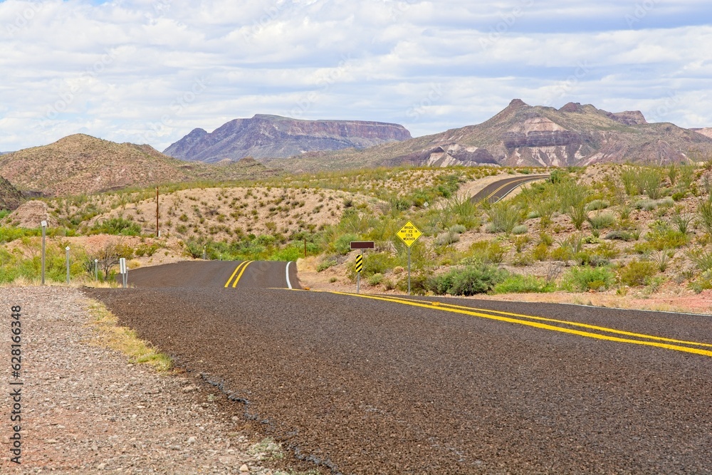 Highway snakes through rolling desert foothills of Big Bend Ranch State ...