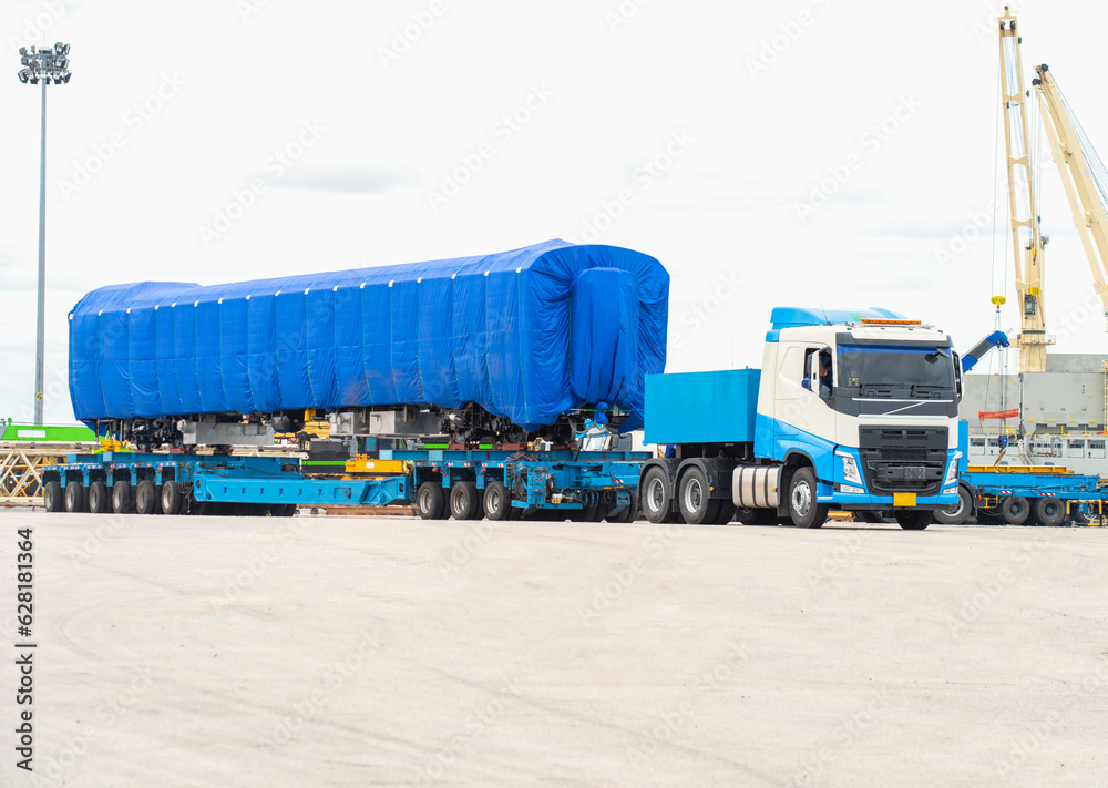Transport of Oversize Heavy cargo trailera new passenger train on a ...