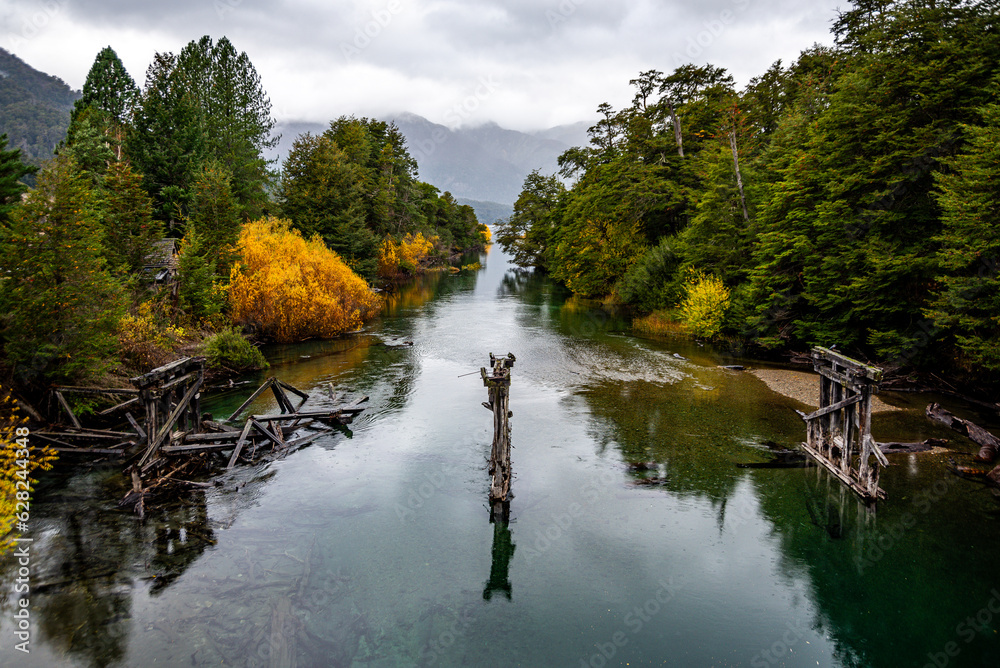 View of the remains of the old wooden bridge that crossed the Ruca ...