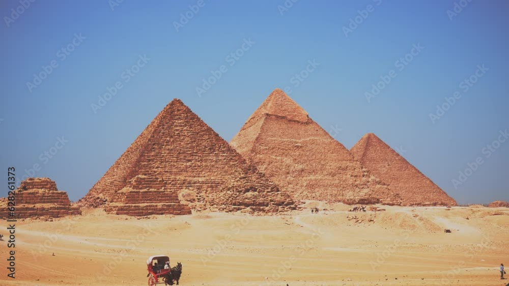 Panoramic view on pyramids with camels bedouins man riding on camel in ...