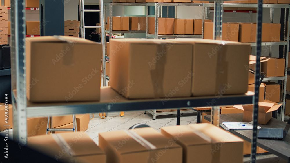 Empty storage room filled with many cardboard boxes on racks, empty ...