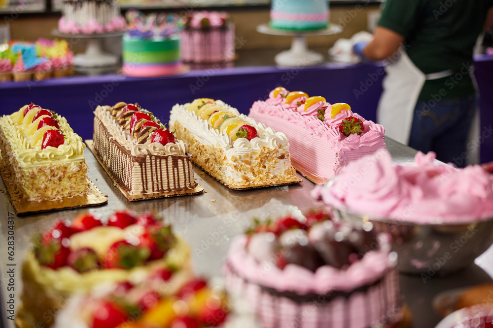 Finished sheet cakes in display case of grocery store bakery, Fudge ...