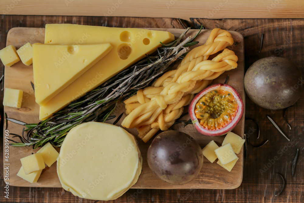 Cheese assorted cut with herbs and fruits.Hard and soft cheeses ...