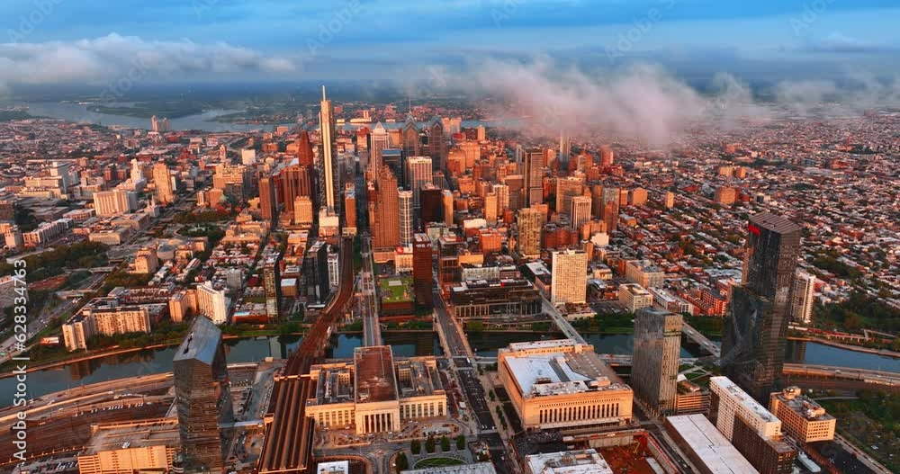 Setting sun lighting beautiful buildings of Philadelphia downtown ...