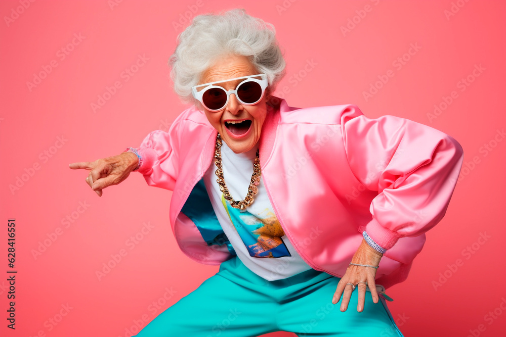 Portrait of a funny grandmother in 80s dance attire with sunglasses on ...
