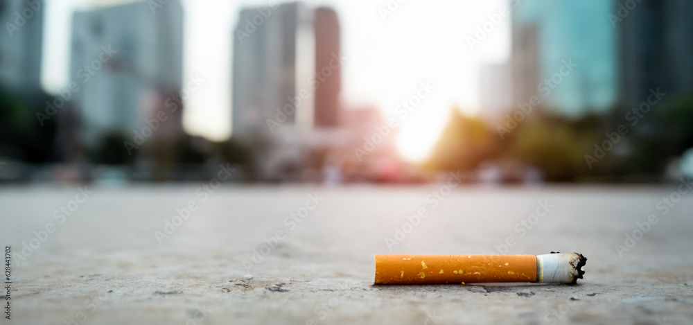 Cigarette on the ground. smoking and smoking concept. Respect for the ...