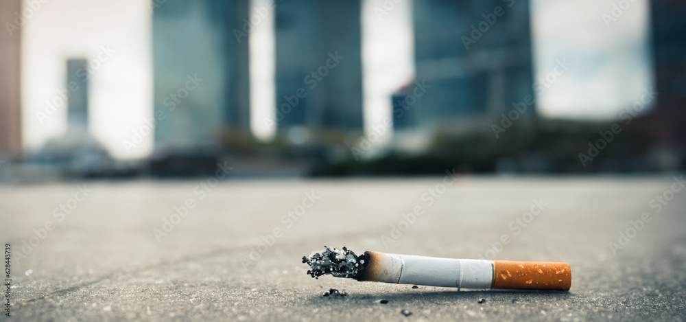 Cigarette on the ground. smoking and smoking concept. Respect for the ...