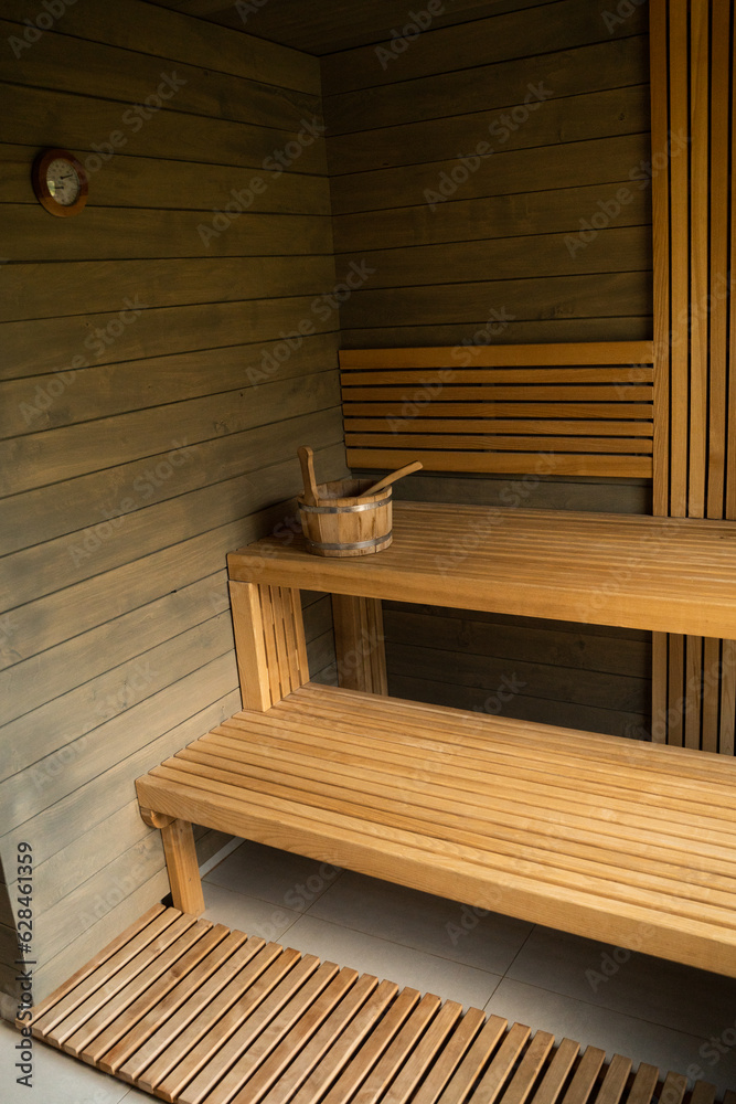 Modern wooden Finnish sauna interior with wooden benches. Wooden ...