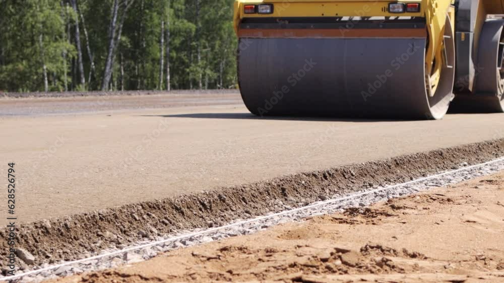 Movement of the road roller for the purpose of compacting the soil ...
