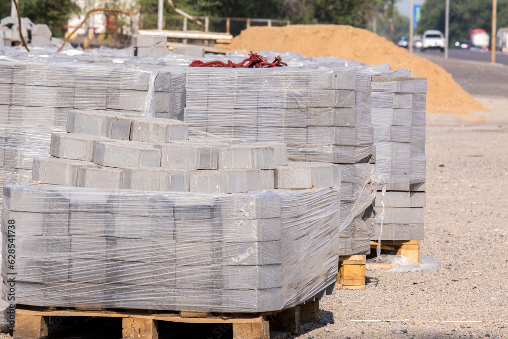 Construction material for the manufacture of sidewalks along the ...