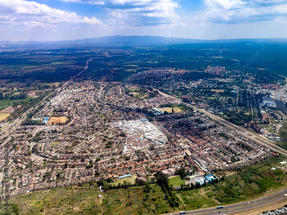 Aerial view of residential areas, garden plots, highways and buildings ...