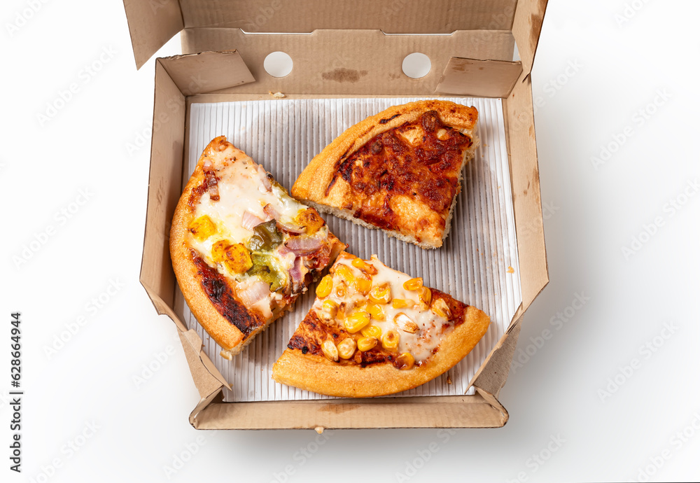 Three different slices of pizza in a cardboard box on a white ...