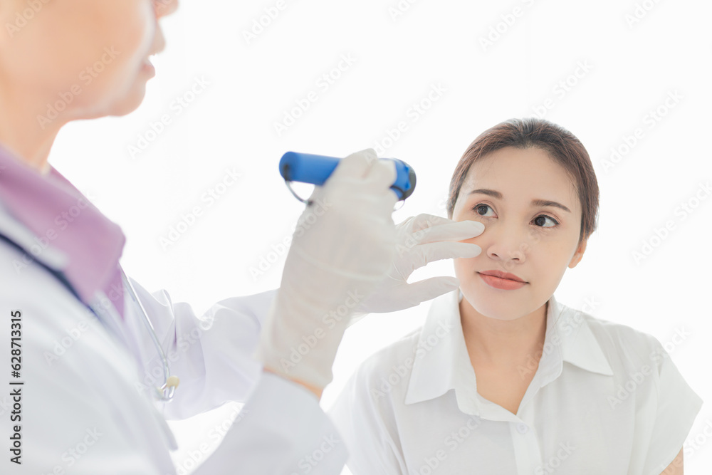 doctor use flashlight screening conjunctivitis patient, asian patient ...